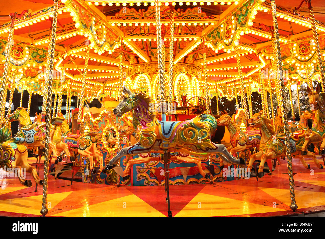 colorful carousel with lights at night Stock Photo - Alamy