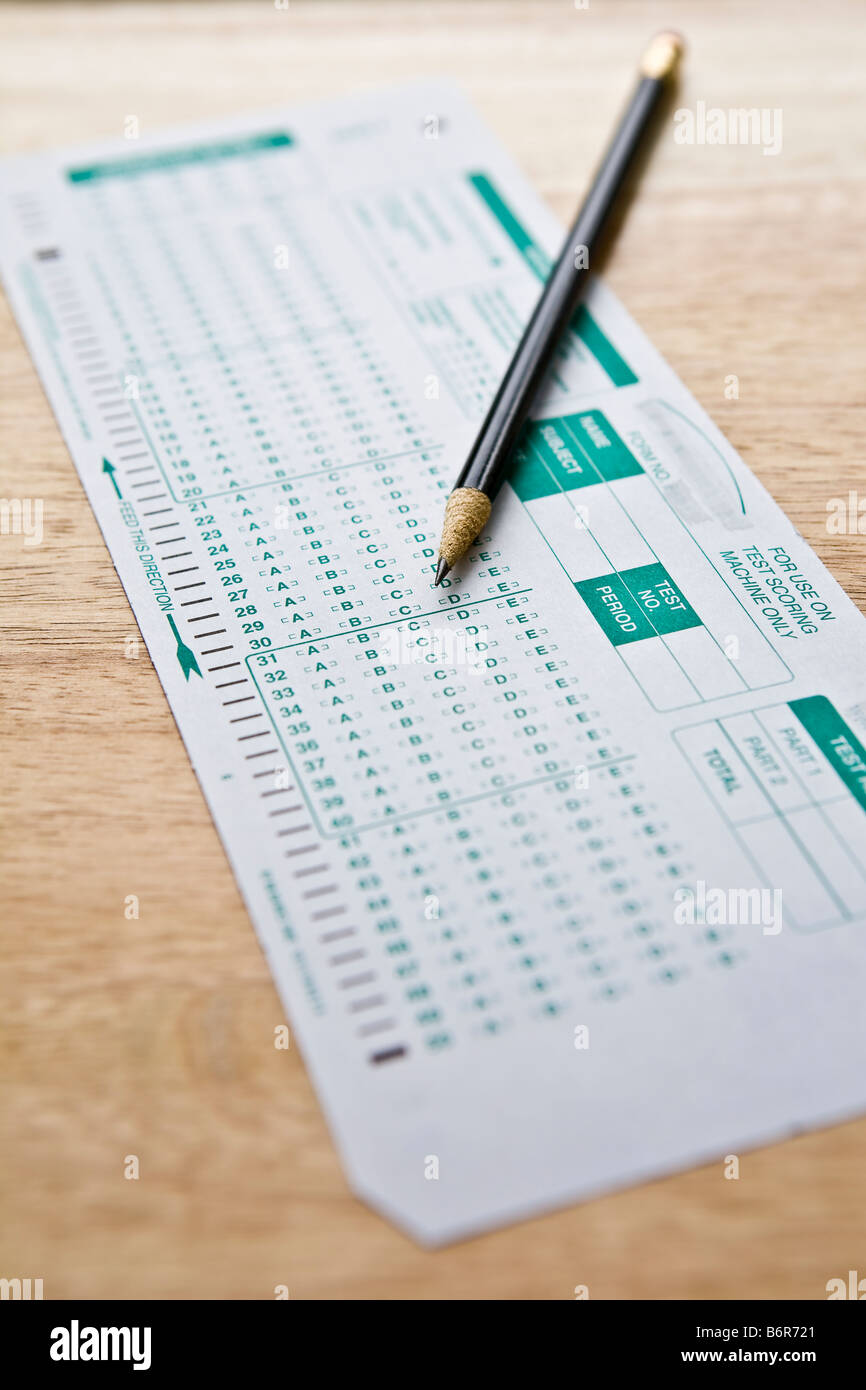 Blank machine scoring form with pencil Stock Photo - Alamy