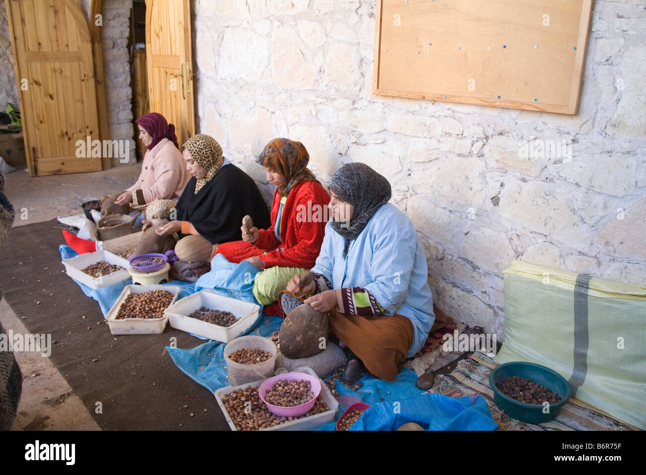 Morocco North Africa December Four Moroccan women using stones to break ...