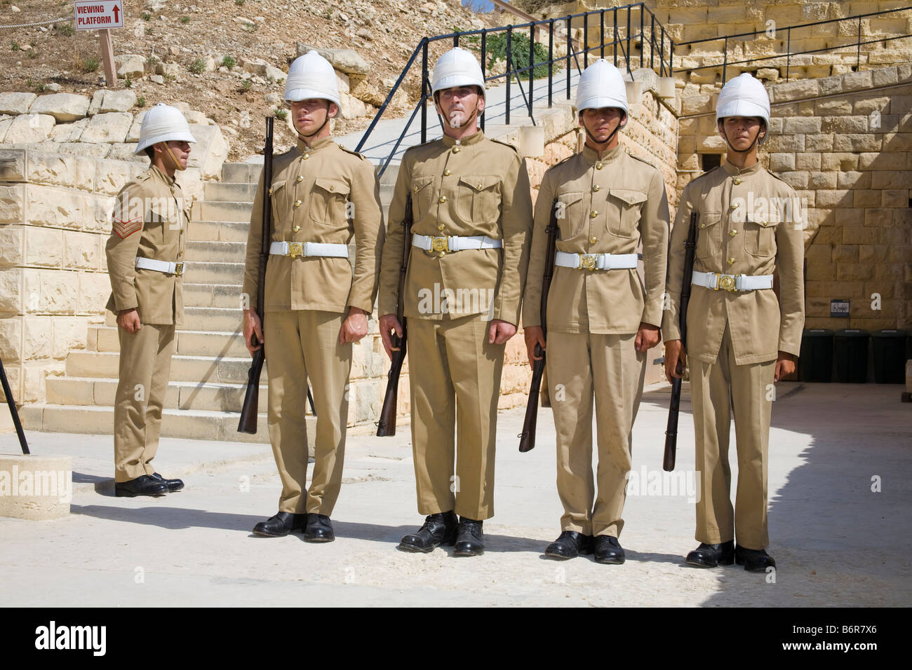 Five soldiers standing to attention, Fort Rinella, Kalkara, Malta Stock ...