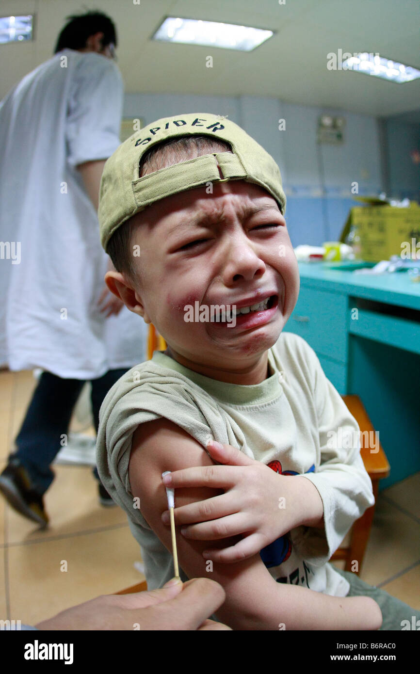 China doctor boy injection hi-res stock photography and images - Alamy
