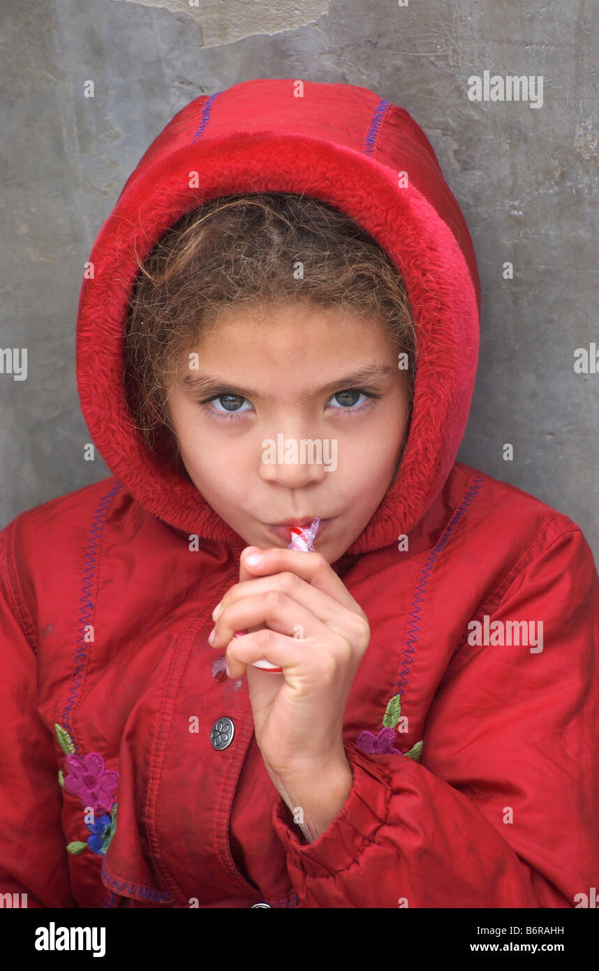 A young, Mexican, girl, eating candy Stock Photo - Alamy