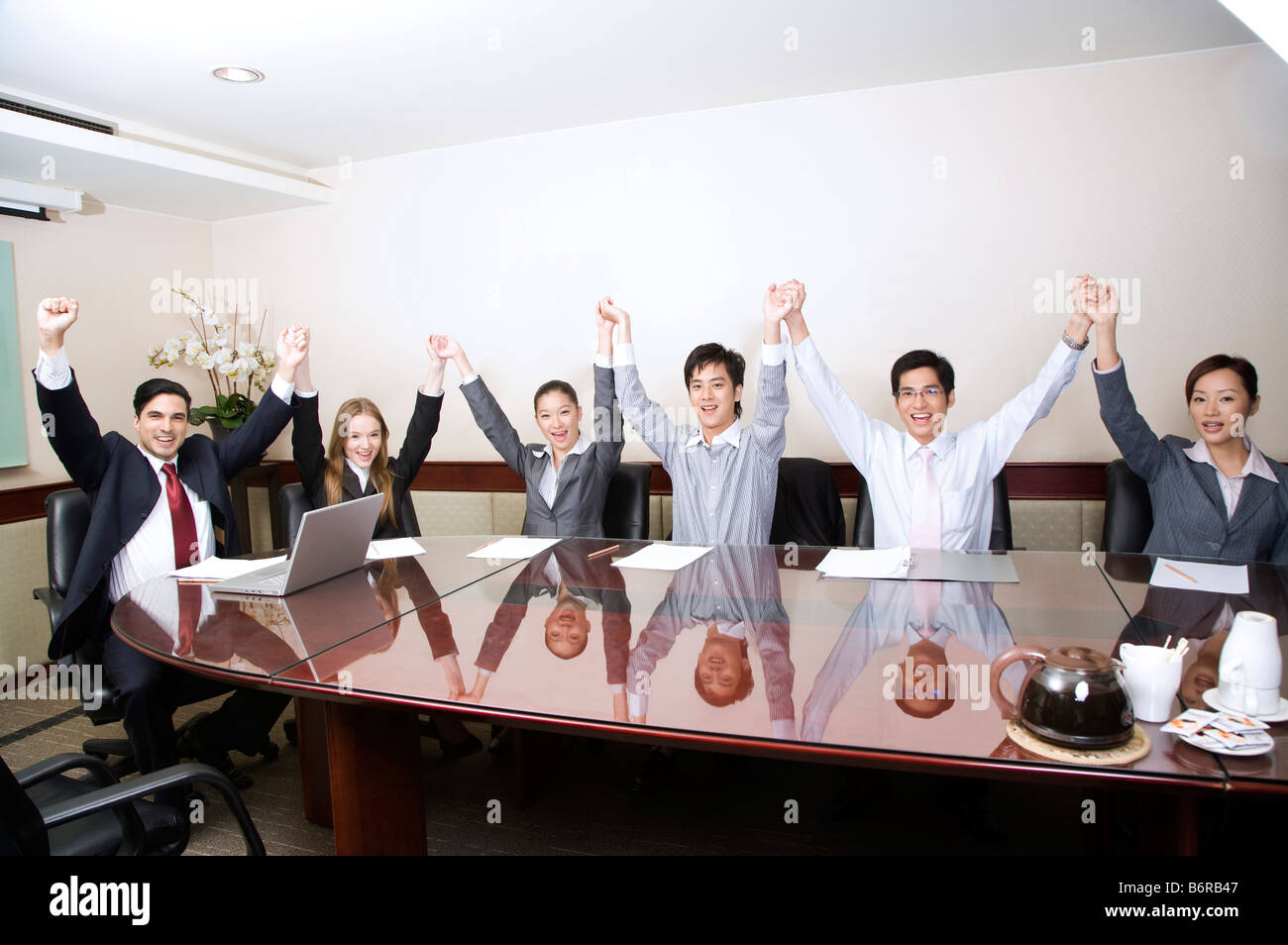 Business people cheering in the office Stock Photo - Alamy