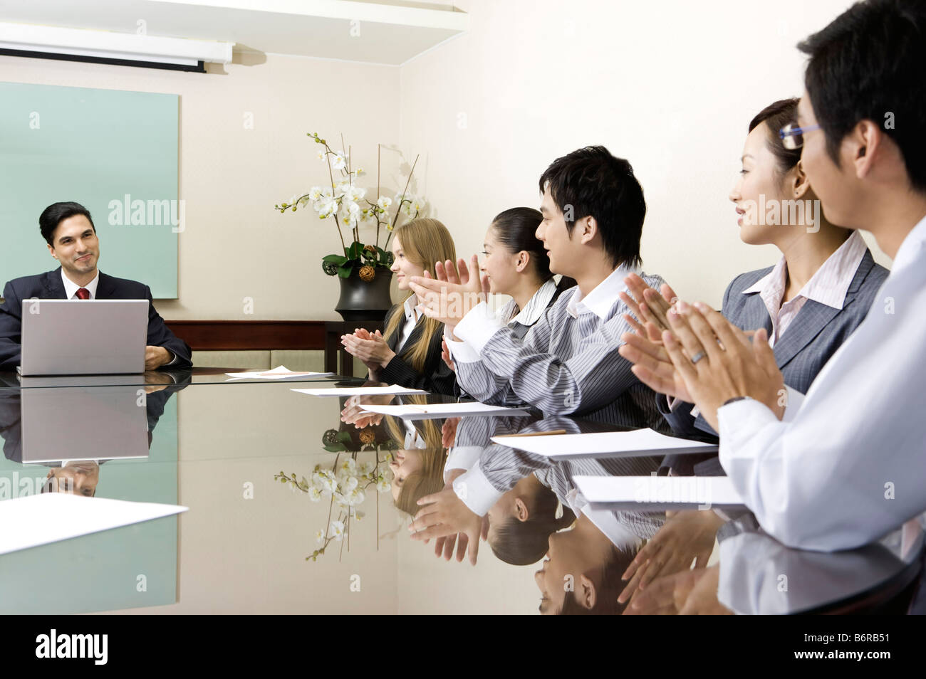 Business people having meeting in the office clapping hands Stock Photo ...