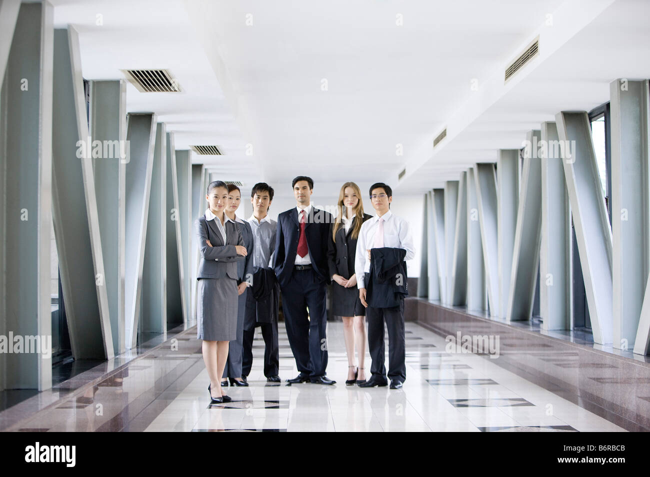 Business people standing in the office building Stock Photo - Alamy
