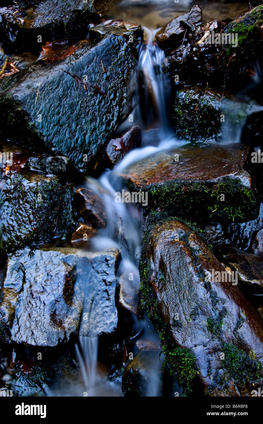 Water tumbling over rocks Stock Photo - Alamy