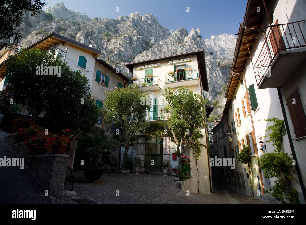 Limone, pretty village on lake Garda with dolomite mountains in the ...