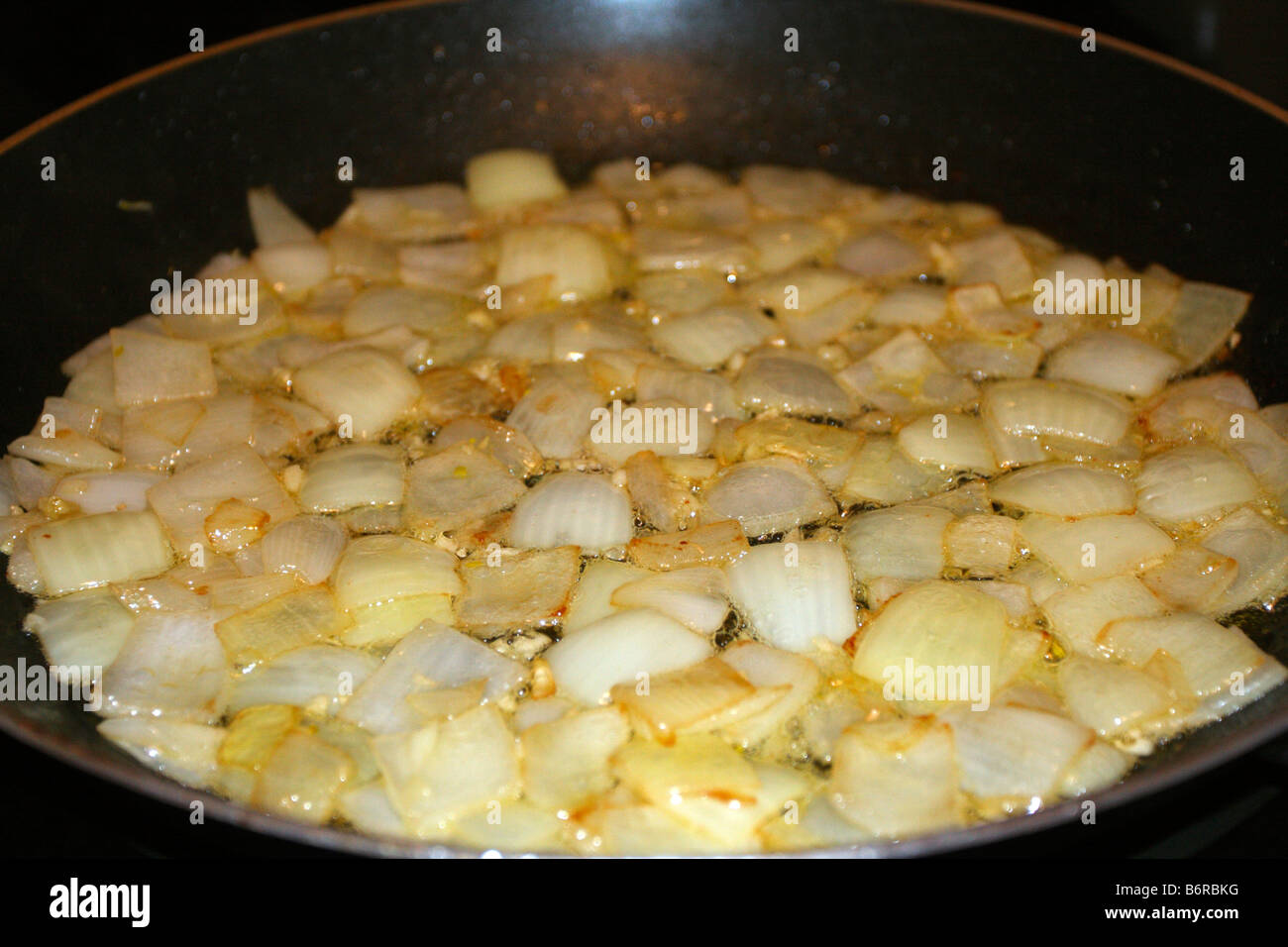 Diced onions in skillet Stock Photo - Alamy