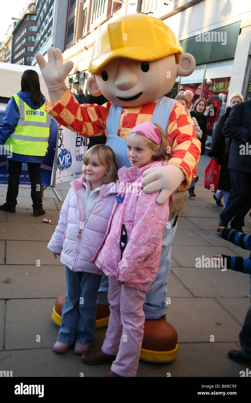 Bob the Builder character poses with children in Oxford Street, London ...
