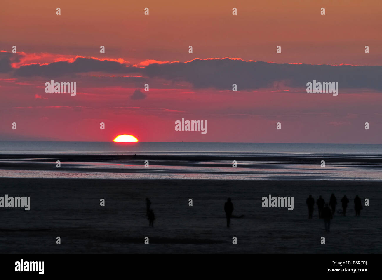 Setting sun over water sea Ribble Estuary Fylde Coast line Stock Photo ...