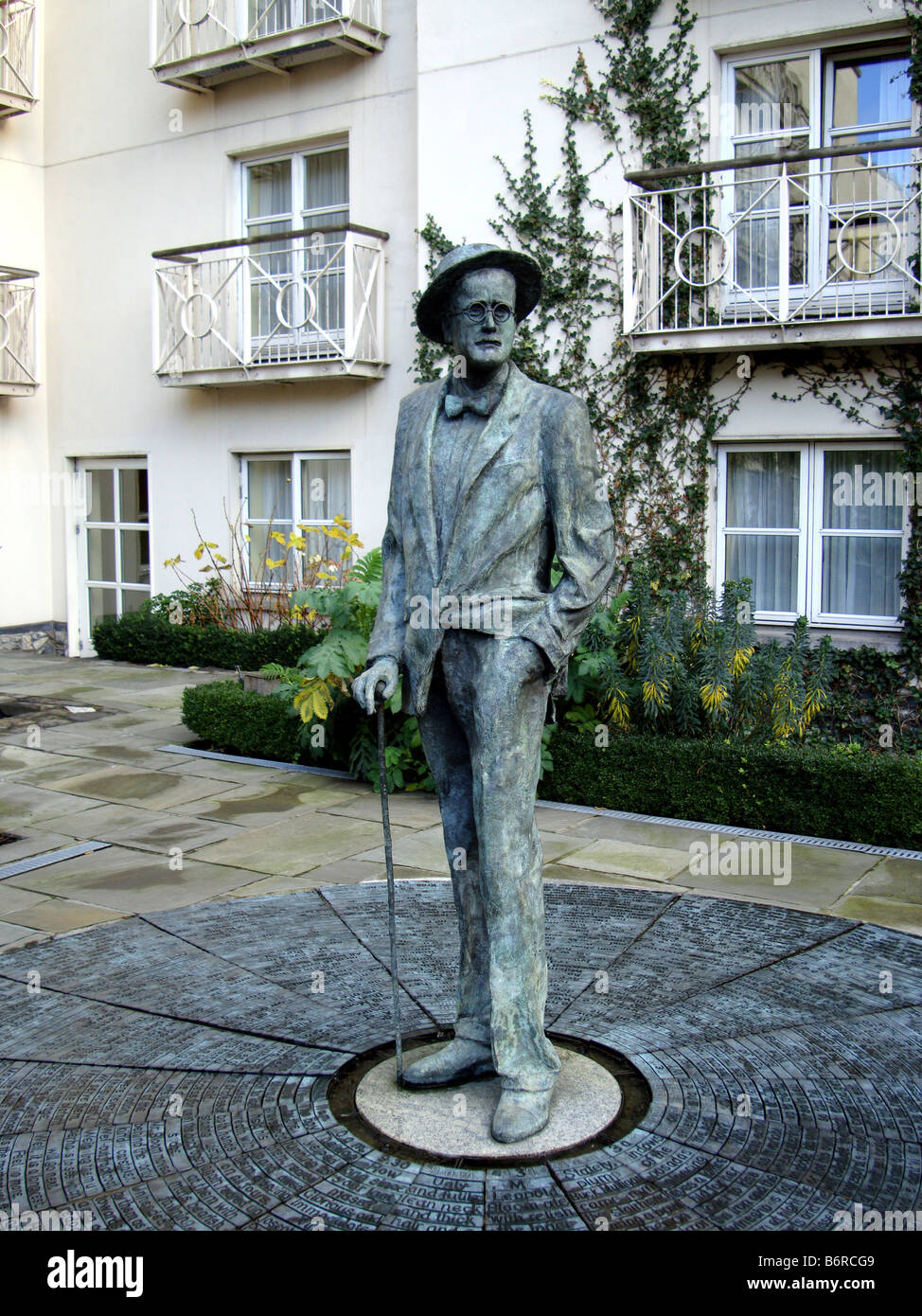 A bronze sculpture of the famous writer James Joyce in the garden of ...