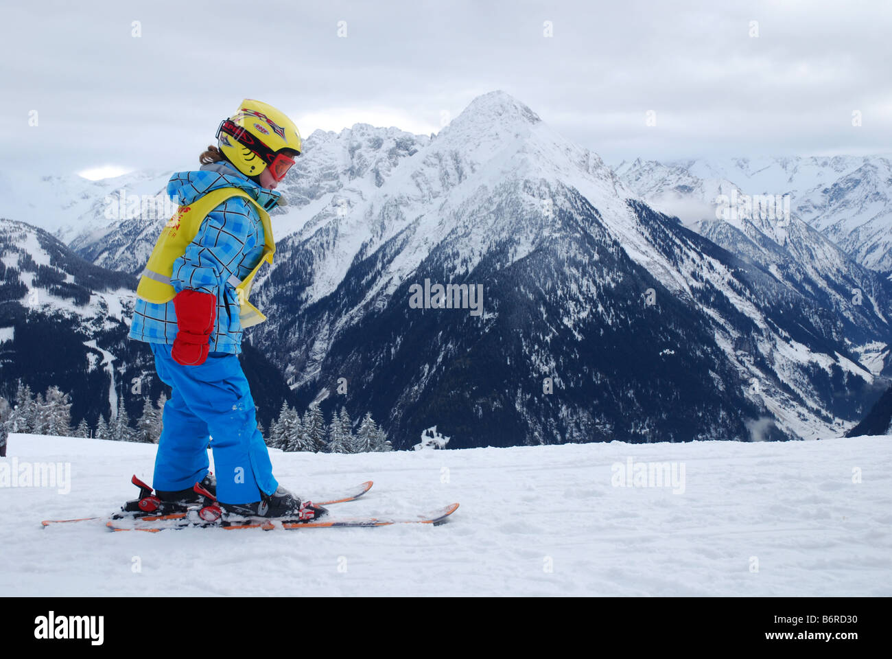 young kid in ski gear on mountain slope Stock Photo - Alamy