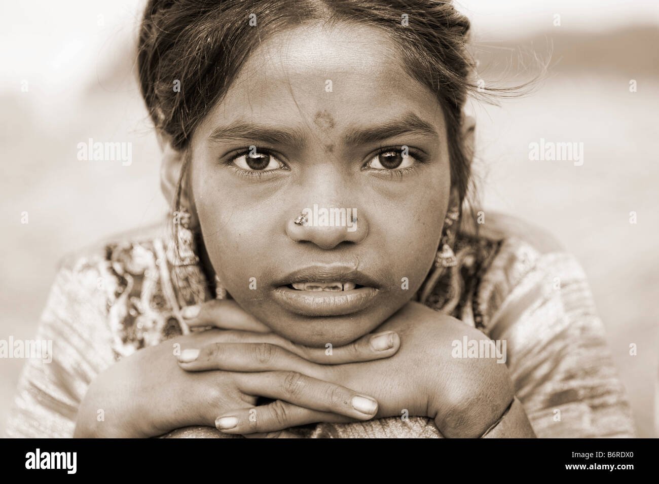 Poor nomadic indian girl portrait, Andhra Pradesh, India. Sepia tone ...