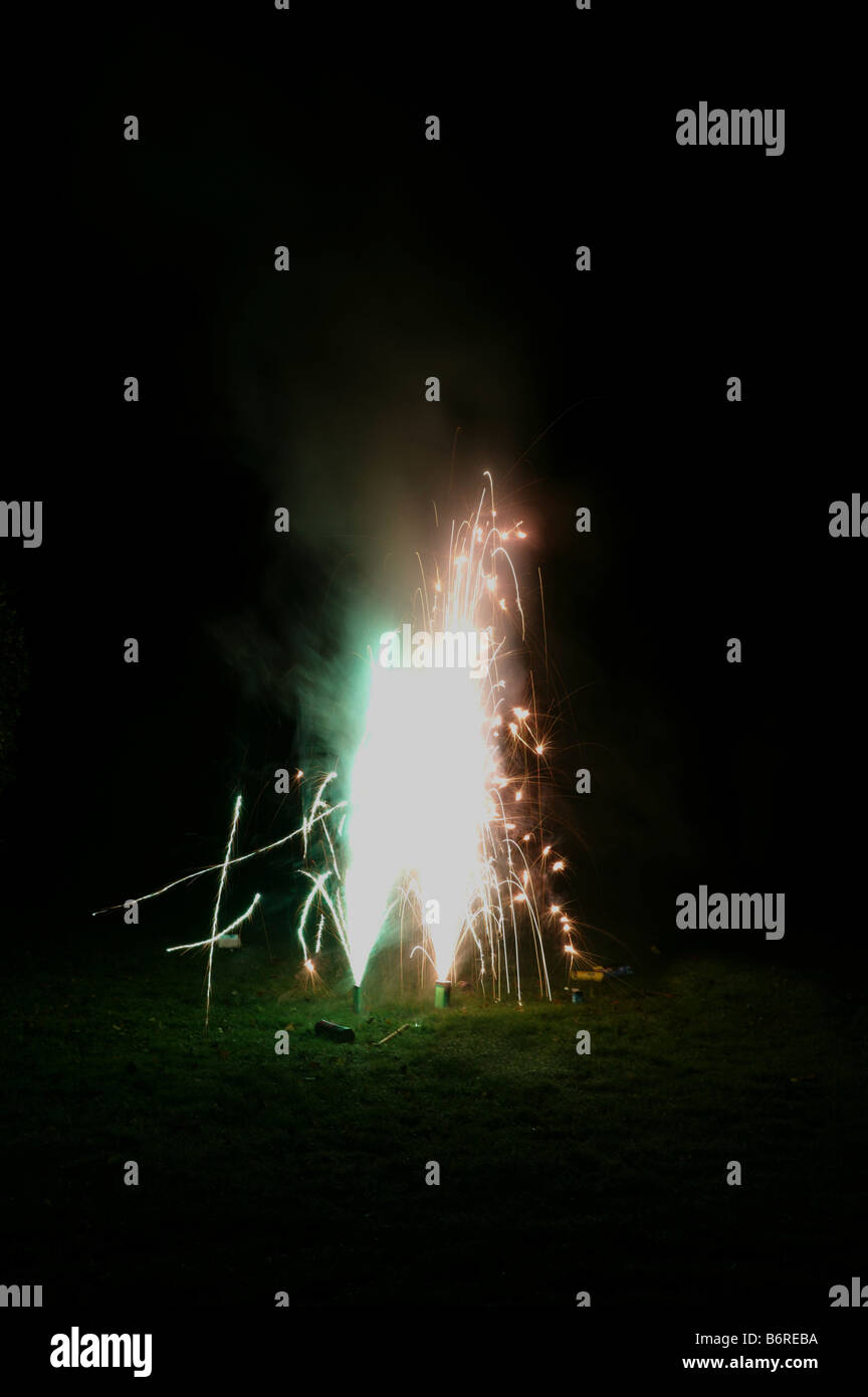 small family firework display in personal space on lawn in darkness in ...