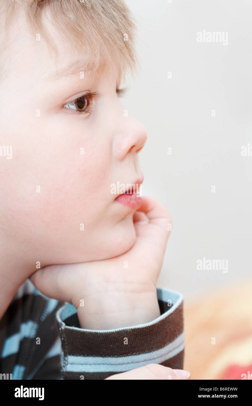 boy popping up his chin Stock Photo - Alamy