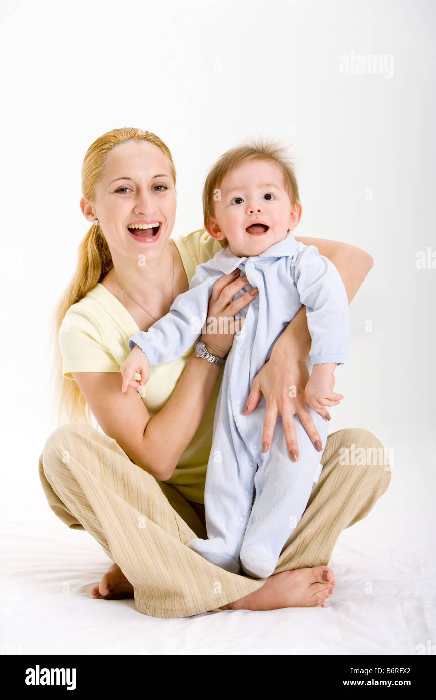 Mother holding baby boy smiling portrait Stock Photo - Alamy