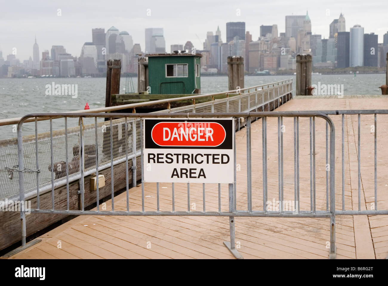 Pier blocked off with danger sign looking across to Manhattan Stock ...