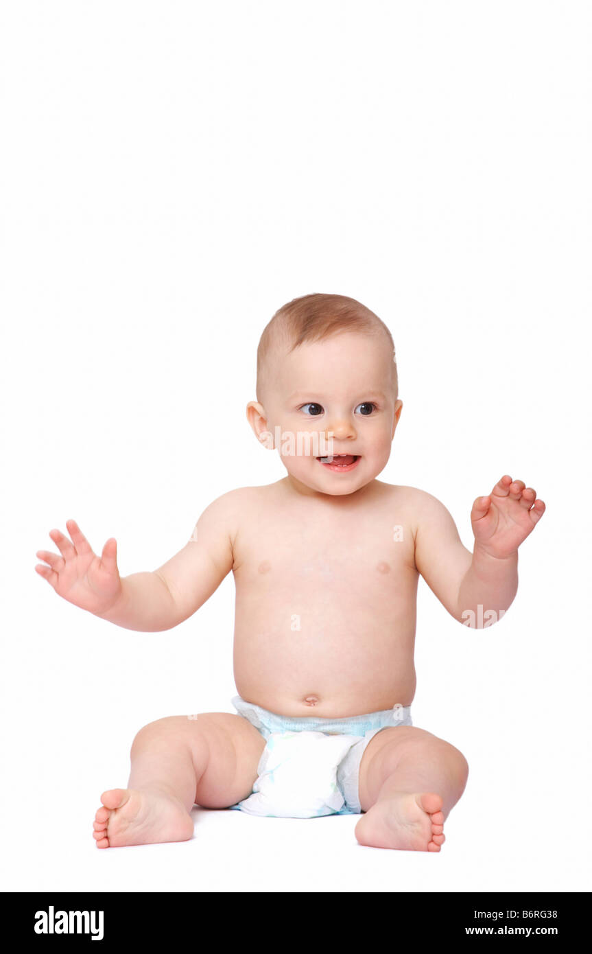 smiling baby sitting on the floor Stock Photo - Alamy