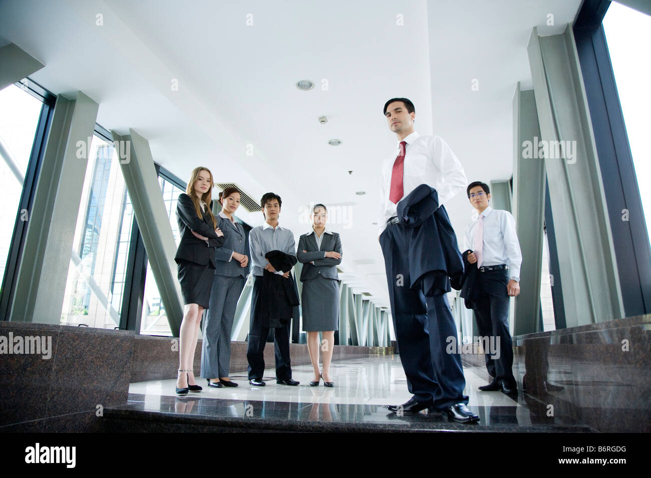 Business people standing in the office building Stock Photo - Alamy
