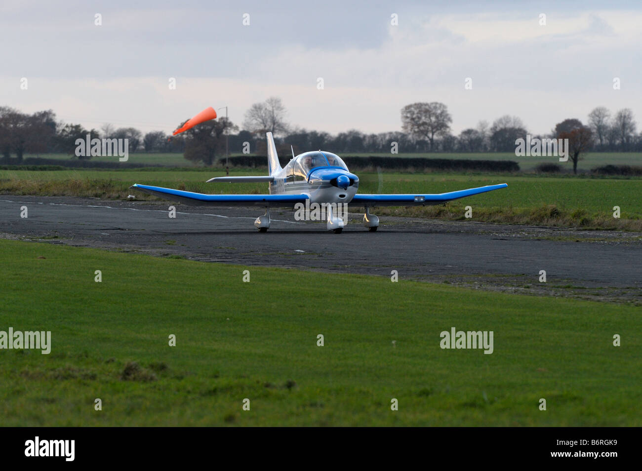 Light aircraft landing Stock Photo - Alamy