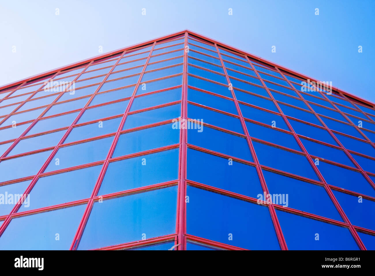 Blue windows from office building against blue sky Stock Photo - Alamy
