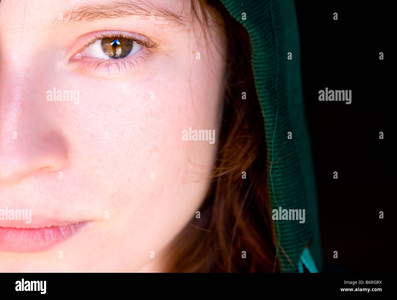 Young woman staring at camera Stock Photo - Alamy