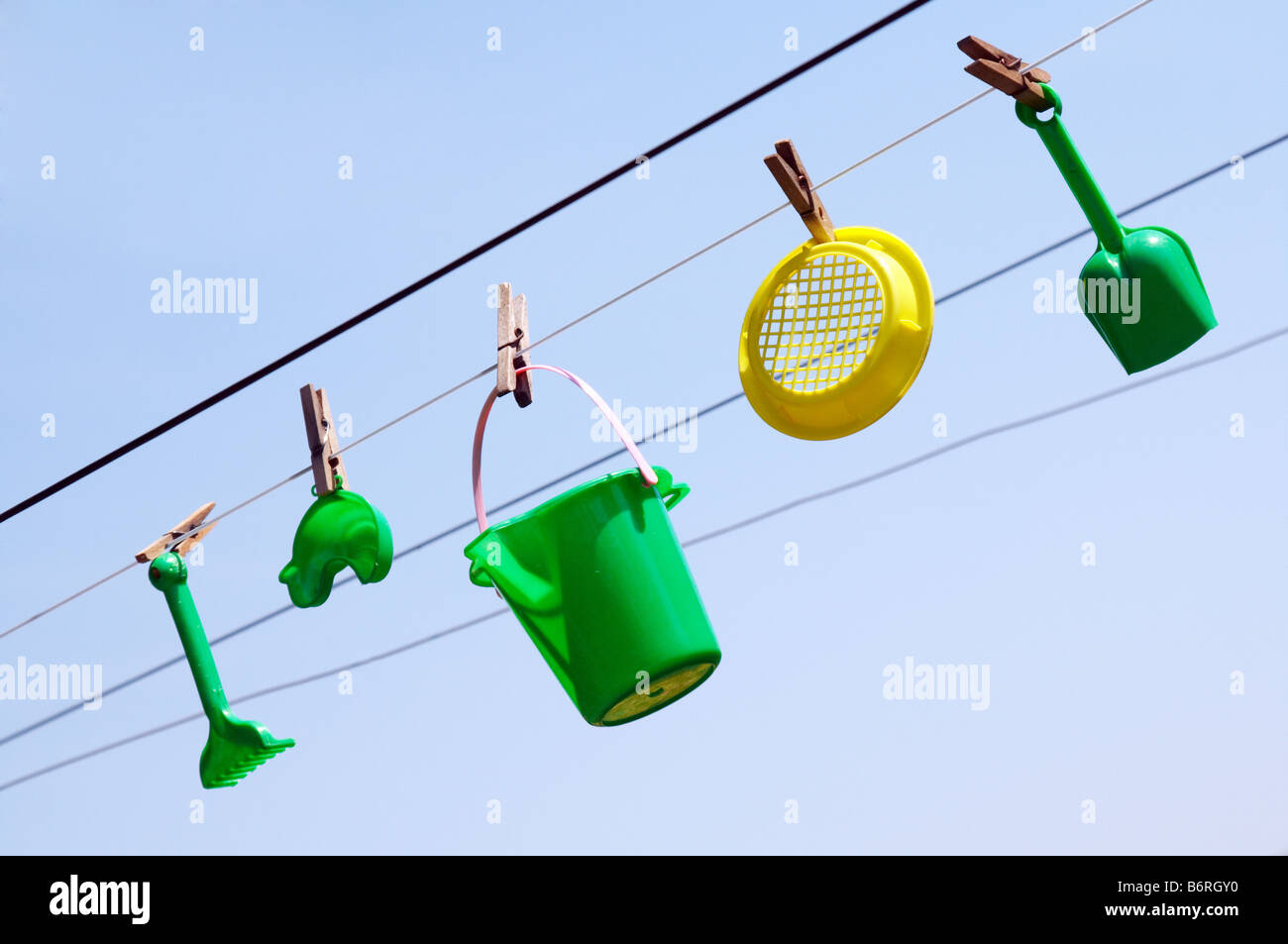 child's toys on the clothesline Stock Photo - Alamy