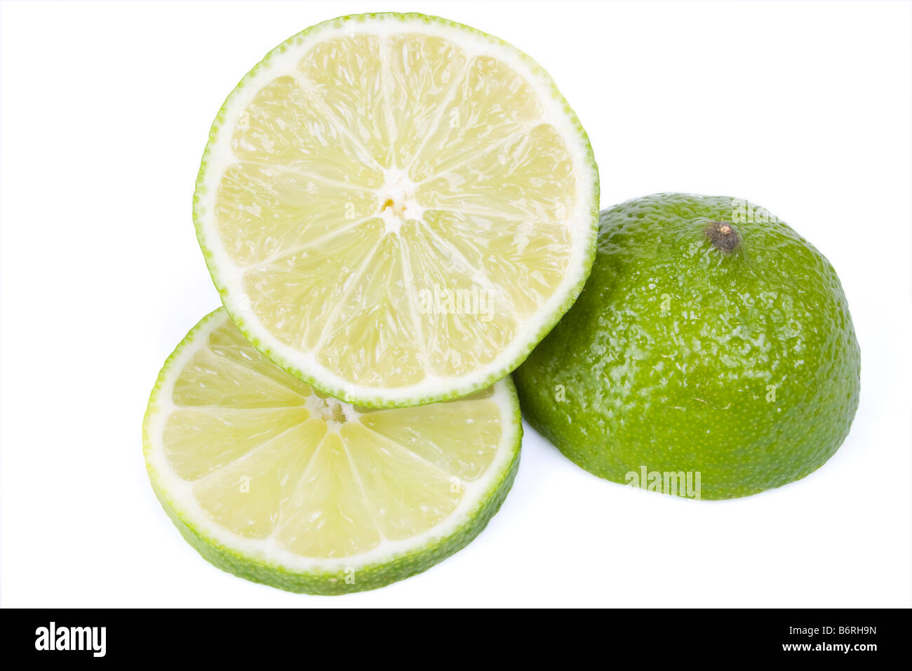 Lime halves and slice Stock Photo - Alamy