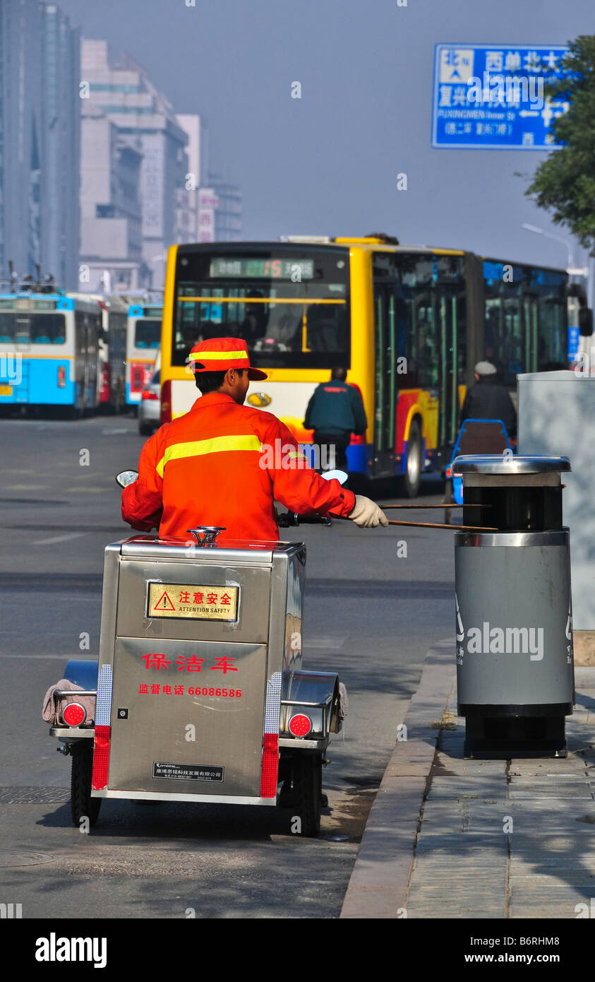 City worker picking up garbage in Beijing China Stock Photo - Alamy