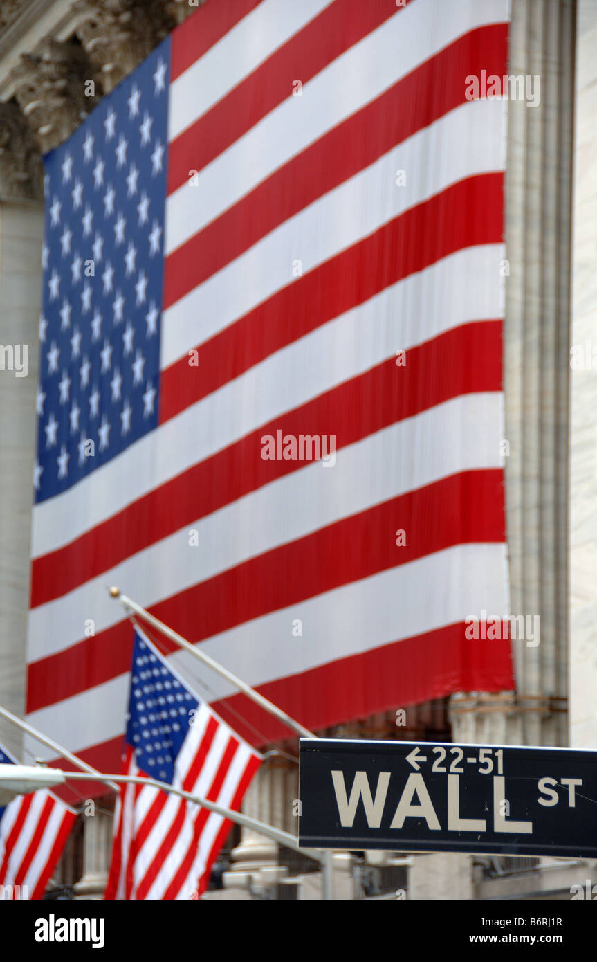 Wall Street street sign with US flag in New York City Stock Photo - Alamy