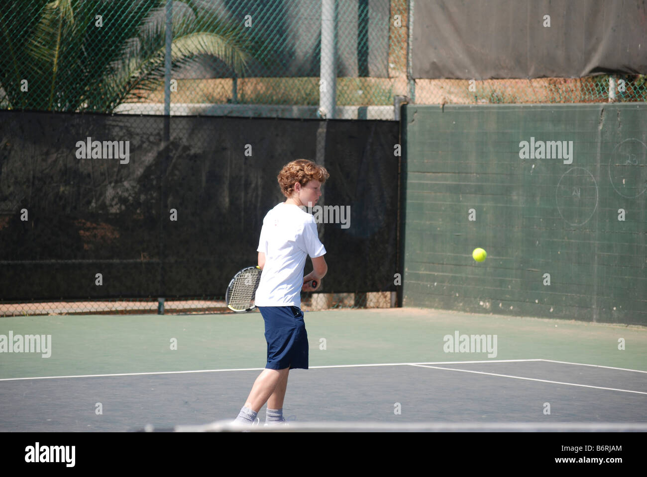 young teenager playing tennis Stock Photo - Alamy