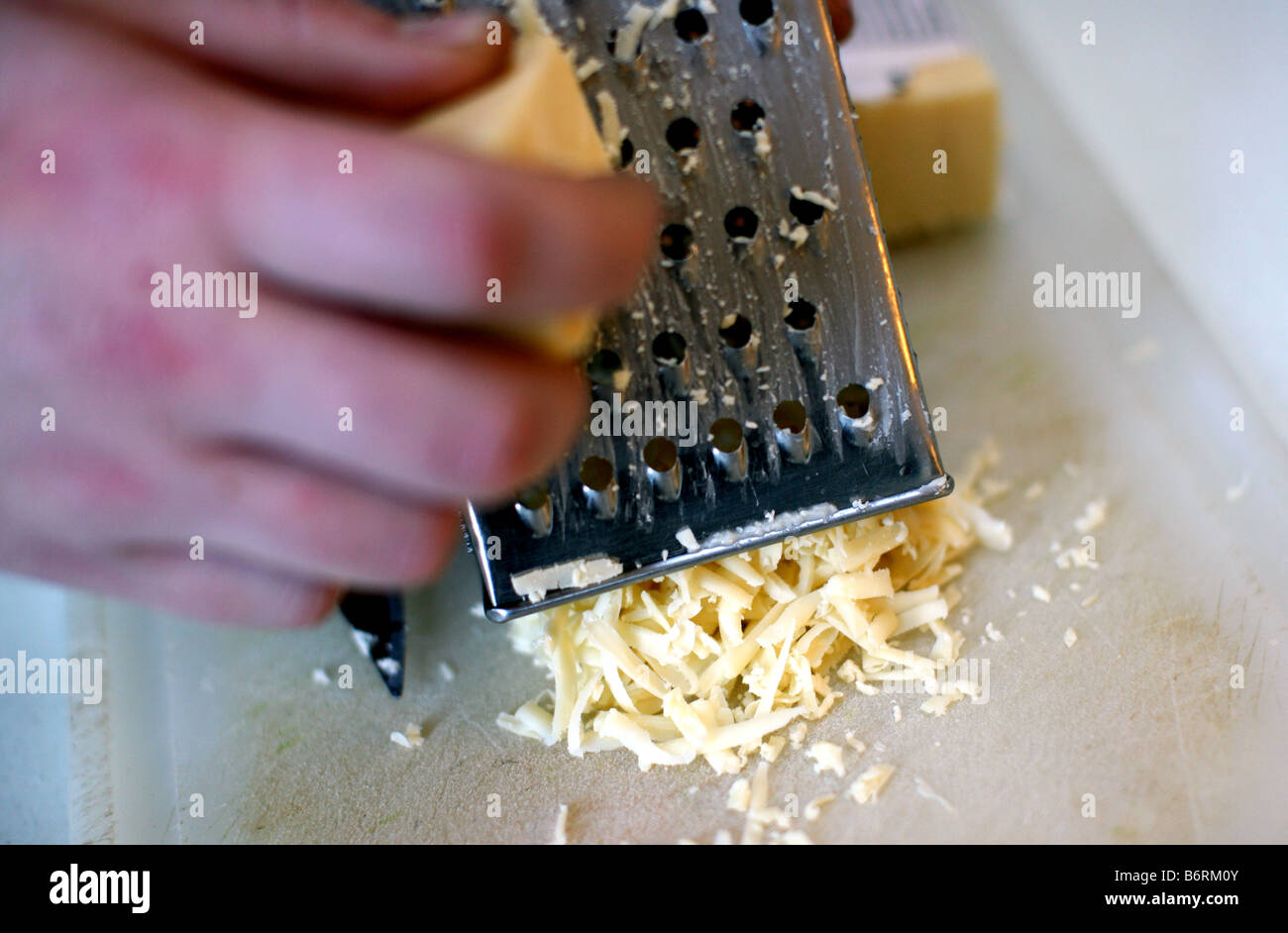 Grating cheese hi-res stock photography and images - Alamy