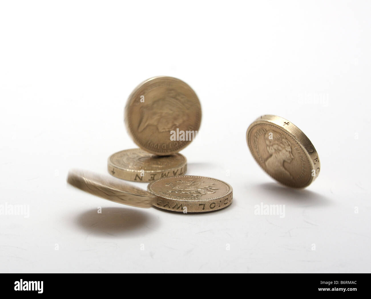 british pound coins tumbling through the air Stock Photo - Alamy