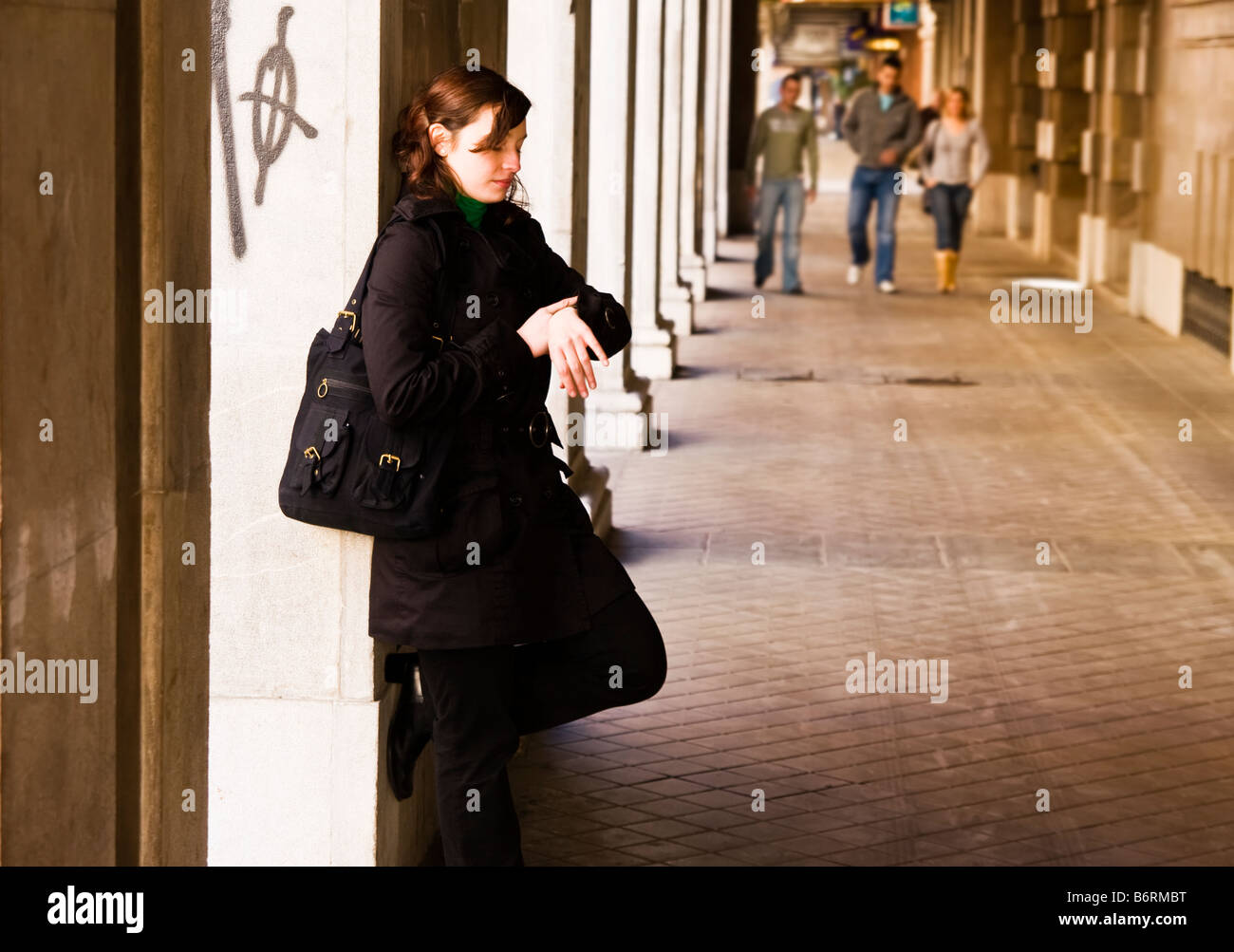 Young waiting woman checking time Stock Photo - Alamy