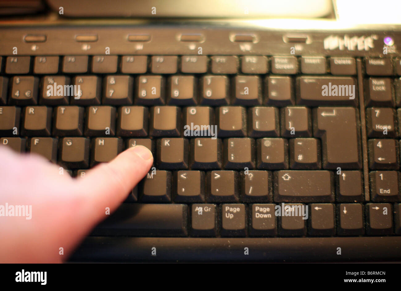Finger on computer keyboard Stock Photo - Alamy