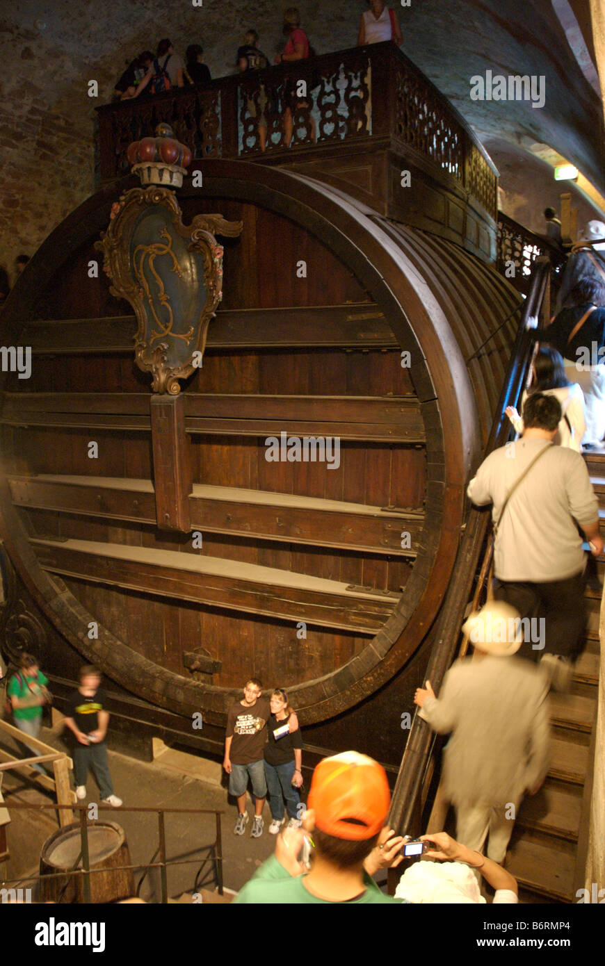 Tourists climbing on the giant barrel at Heidelberg castle Stock Photo ...
