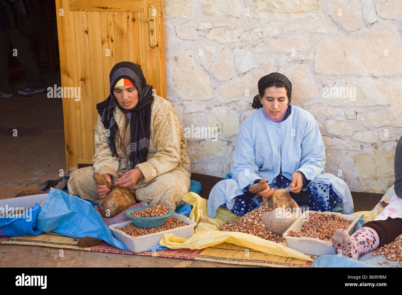 Assous Argan Morocco Berber women working breaking Argan tree nut ...