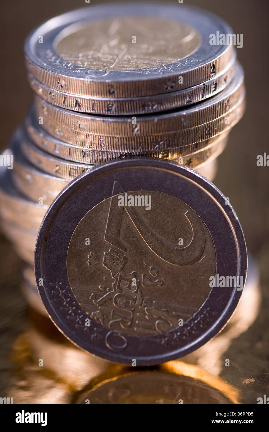2 euro coins stack and separated coin turned to the front Stock Photo ...