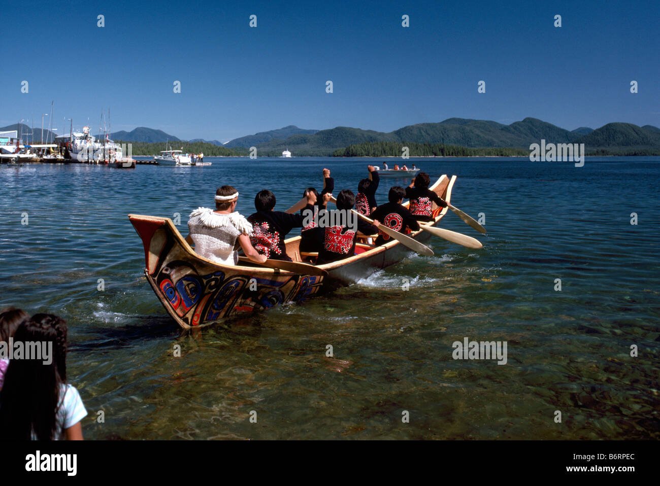 Native American Indians canoeing in a Traditional Dugout Canoe near ...