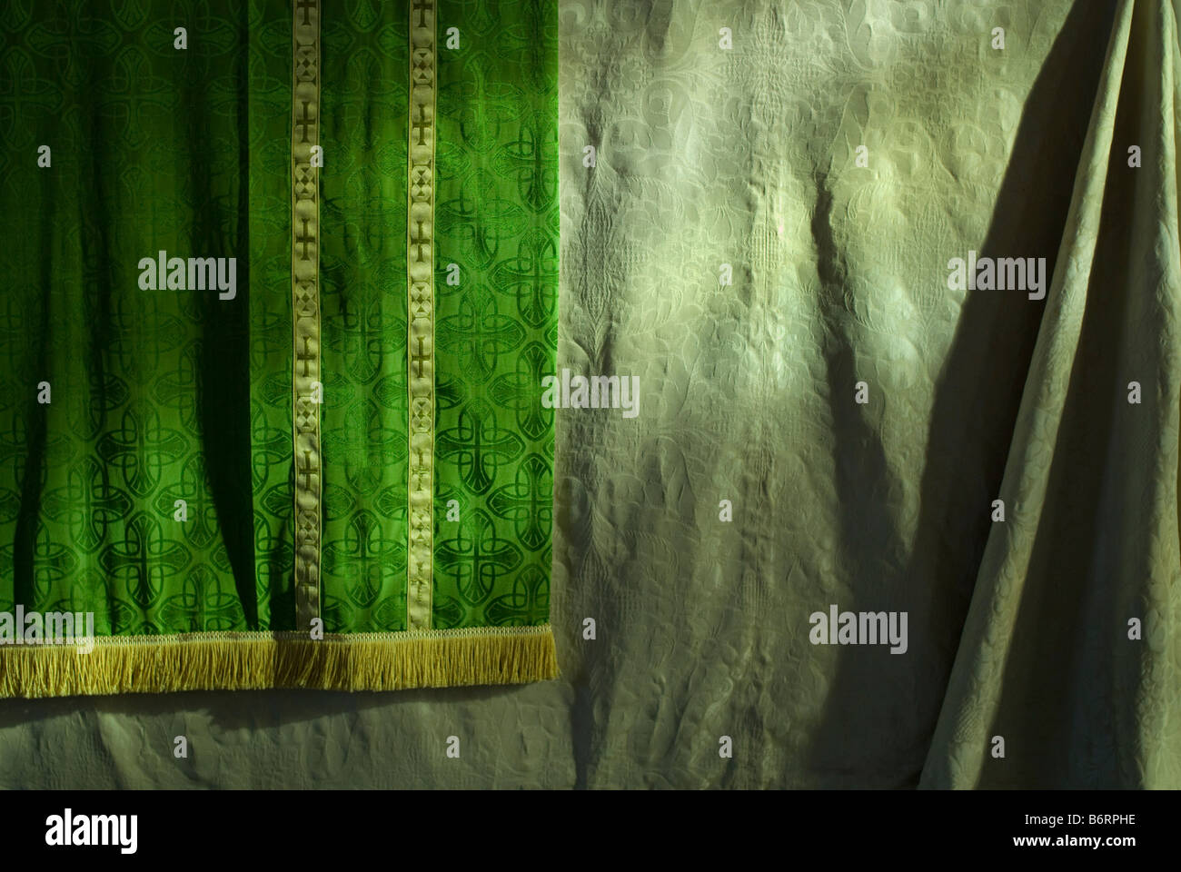 Detail of green cloth draped over a pulpit in an English country church ...