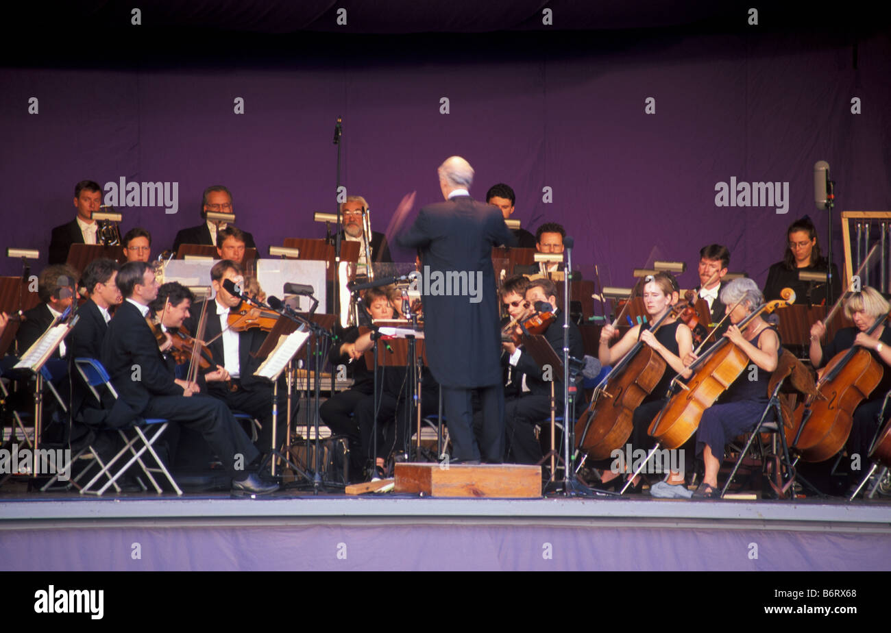 An orchestra performing at an open air concert in Norfolk Stock Photo ...
