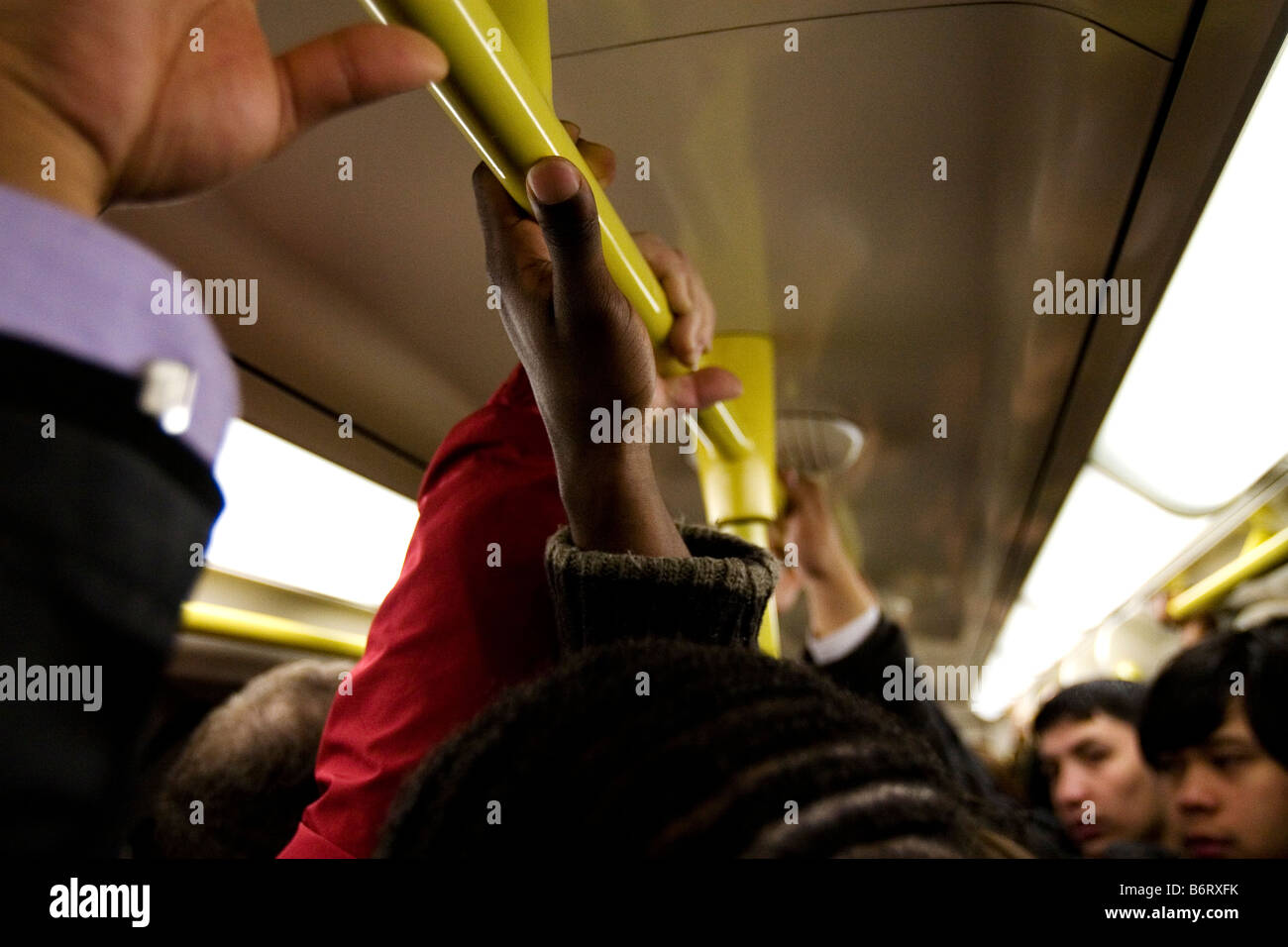 Rush hour hands rail hi-res stock photography and images - Alamy