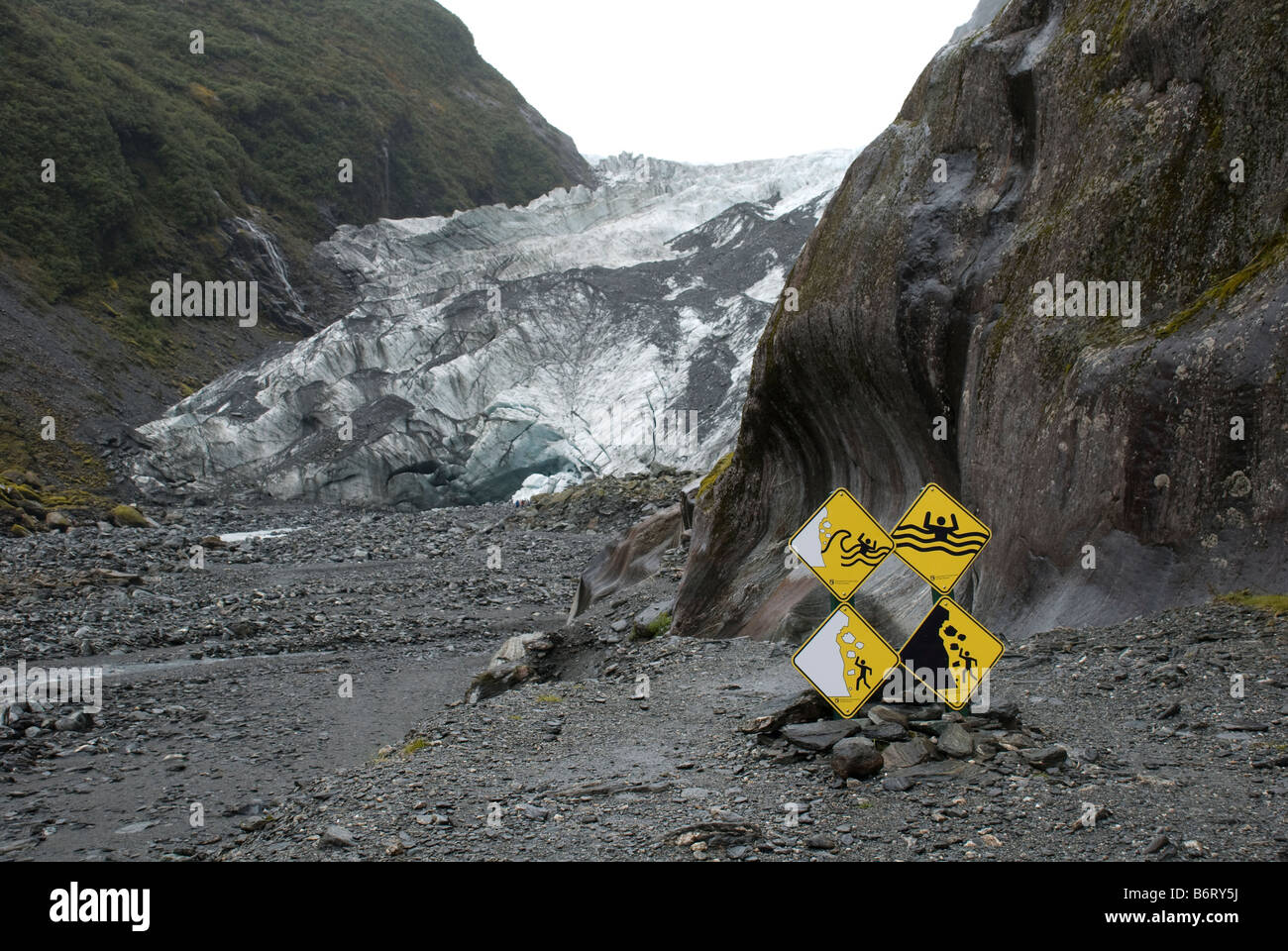 Warning signs in Franz Joseph Glacier Stock Photo - Alamy