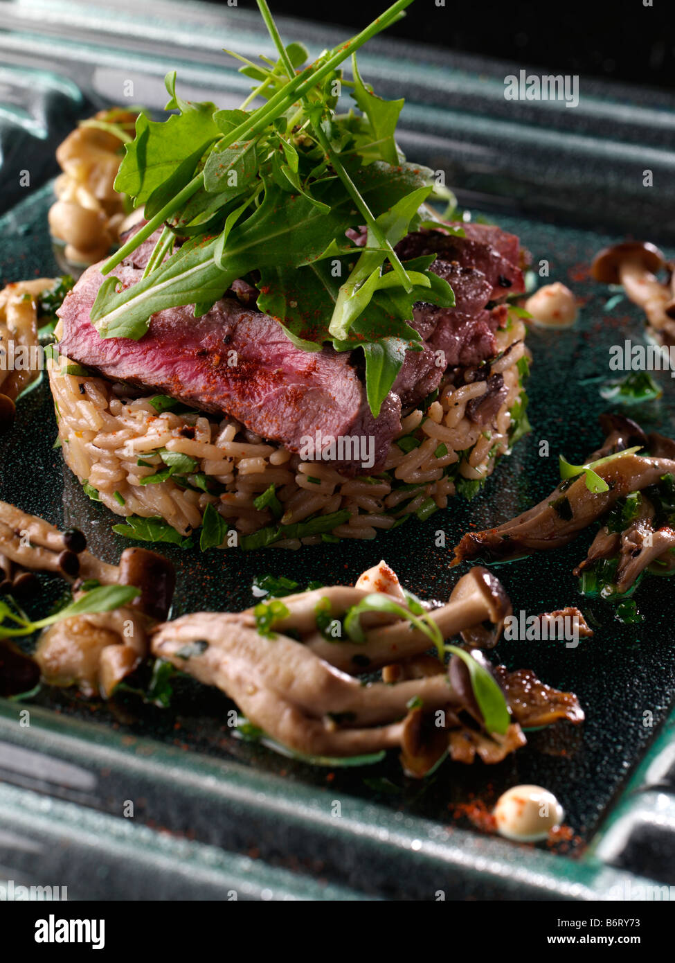 Beef rice timbale mushrooms Stock Photo - Alamy