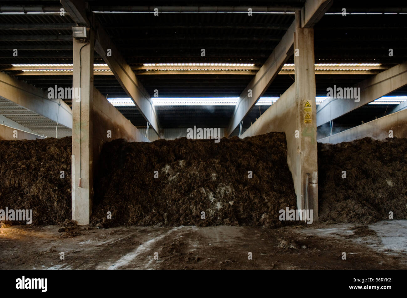 piles of organic material rotting and decomposing for compost ...