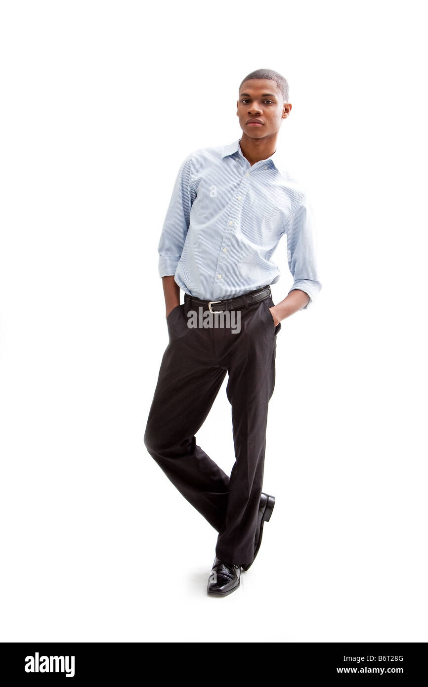 Young African business man standing relaxed and secure with hands in ...