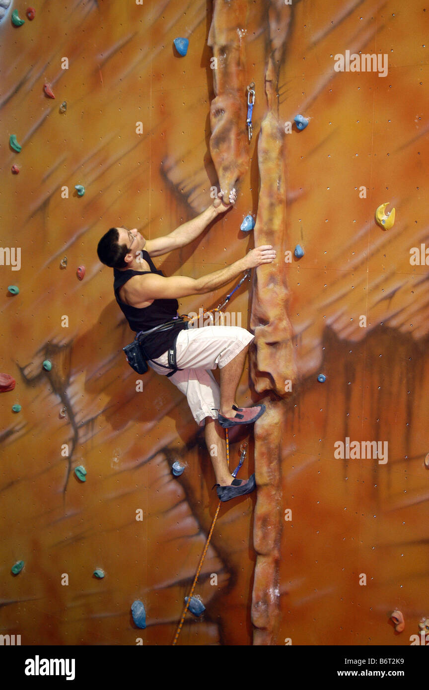 Climber Training on Artificial Indoor Climbing Wall Stock Photo - Alamy