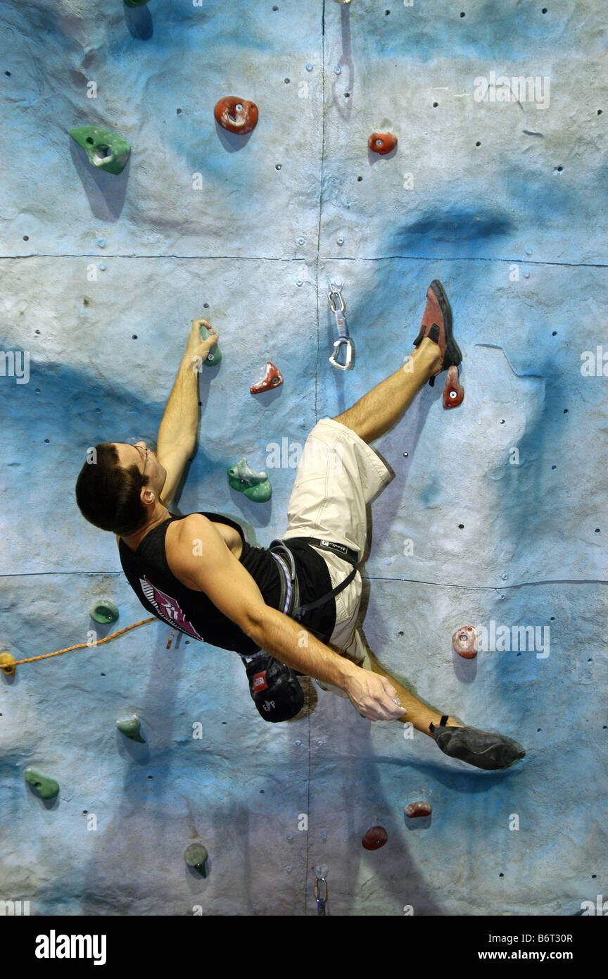 Climber Training on Artificial Indoor Climbing Wall Stock Photo - Alamy