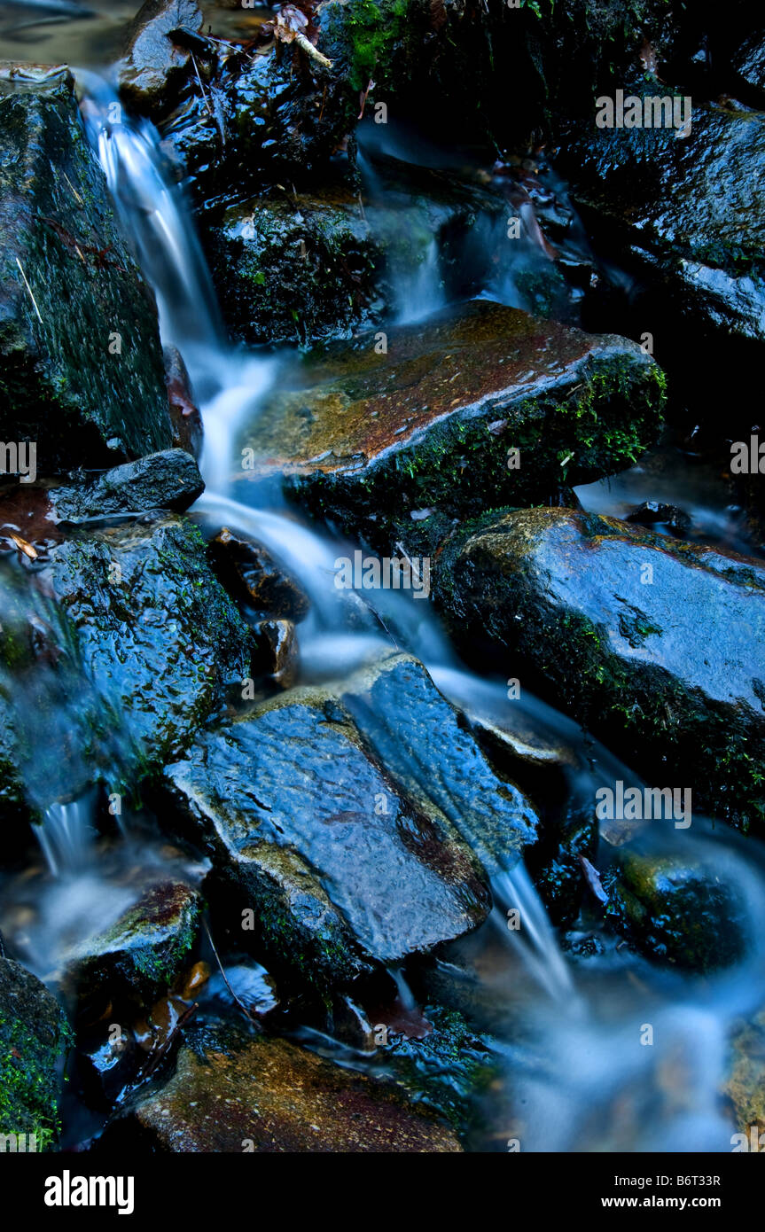 Water tumbling over rocks Stock Photo - Alamy