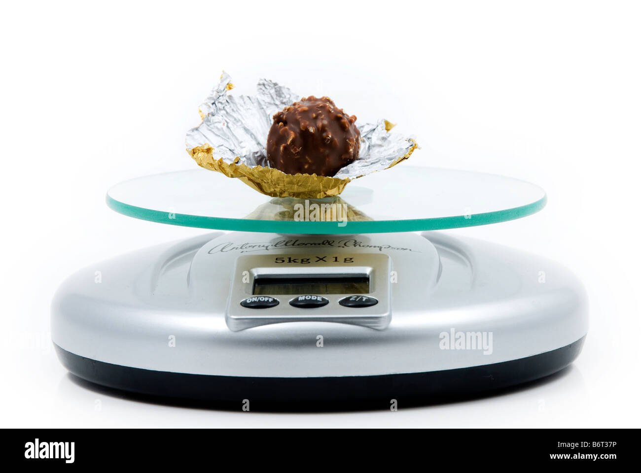 chocolate on a set of scales Stock Photo - Alamy